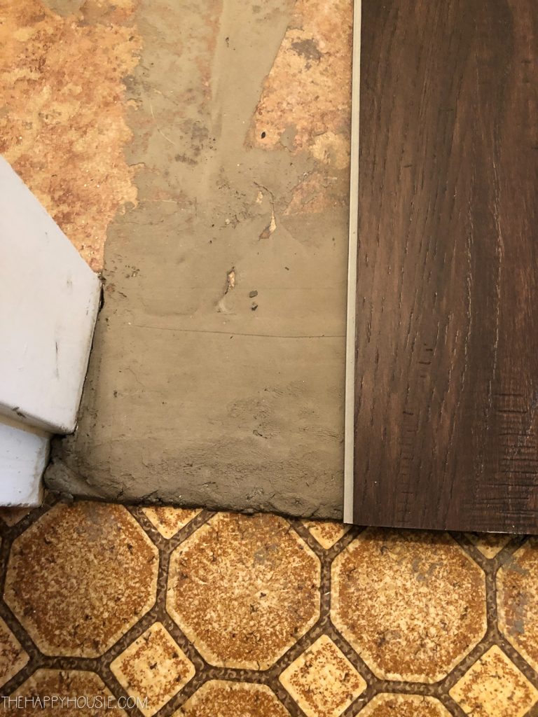 How to Install Vinyl Plank Over Tile Floors | The Happy Housie