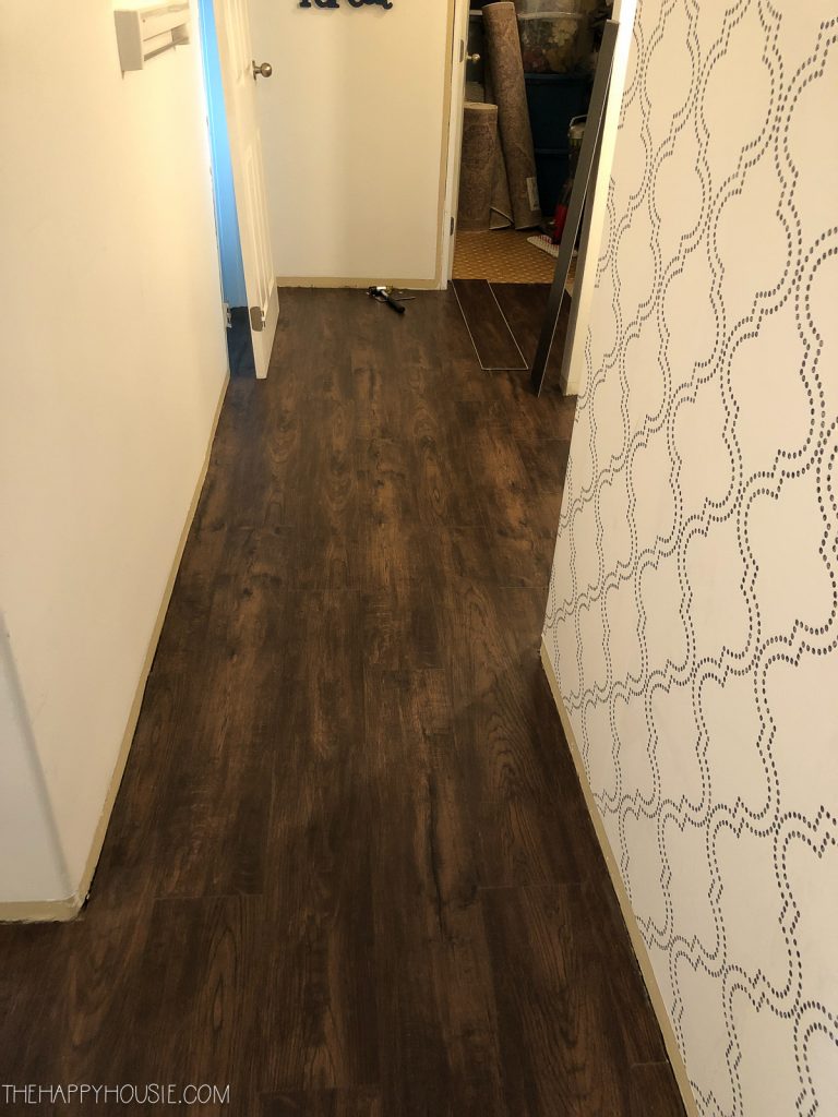 How to Install Vinyl Plank Over Tile Floors | The Happy Housie