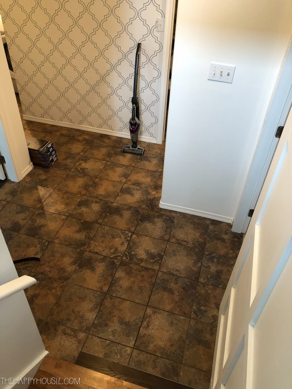 How to Install Vinyl Plank Over Tile Floors | The Happy Housie